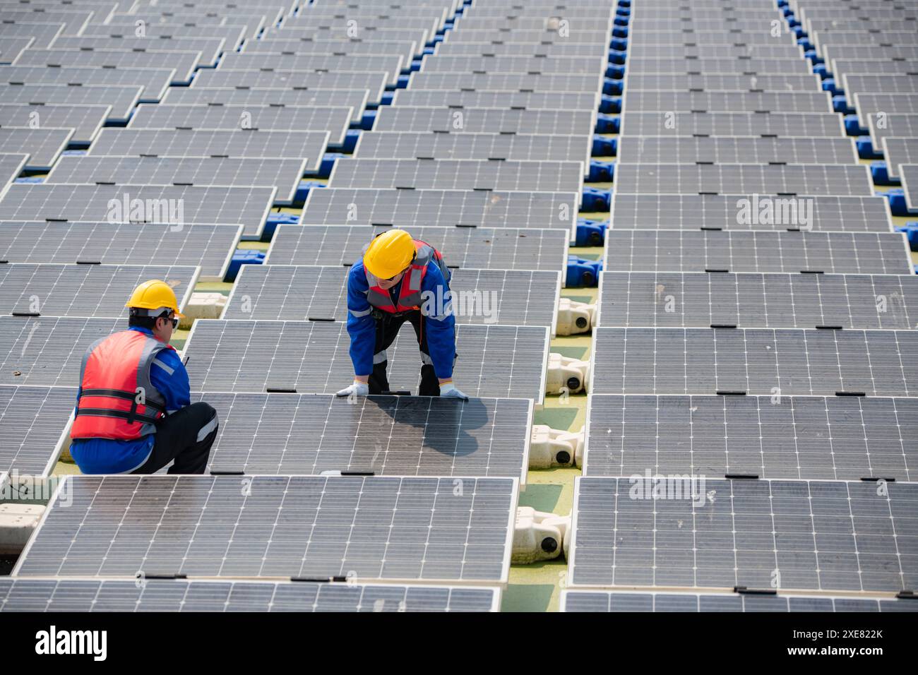 Photovoltaic engineers work on floating photovoltaics. Inspect and ...