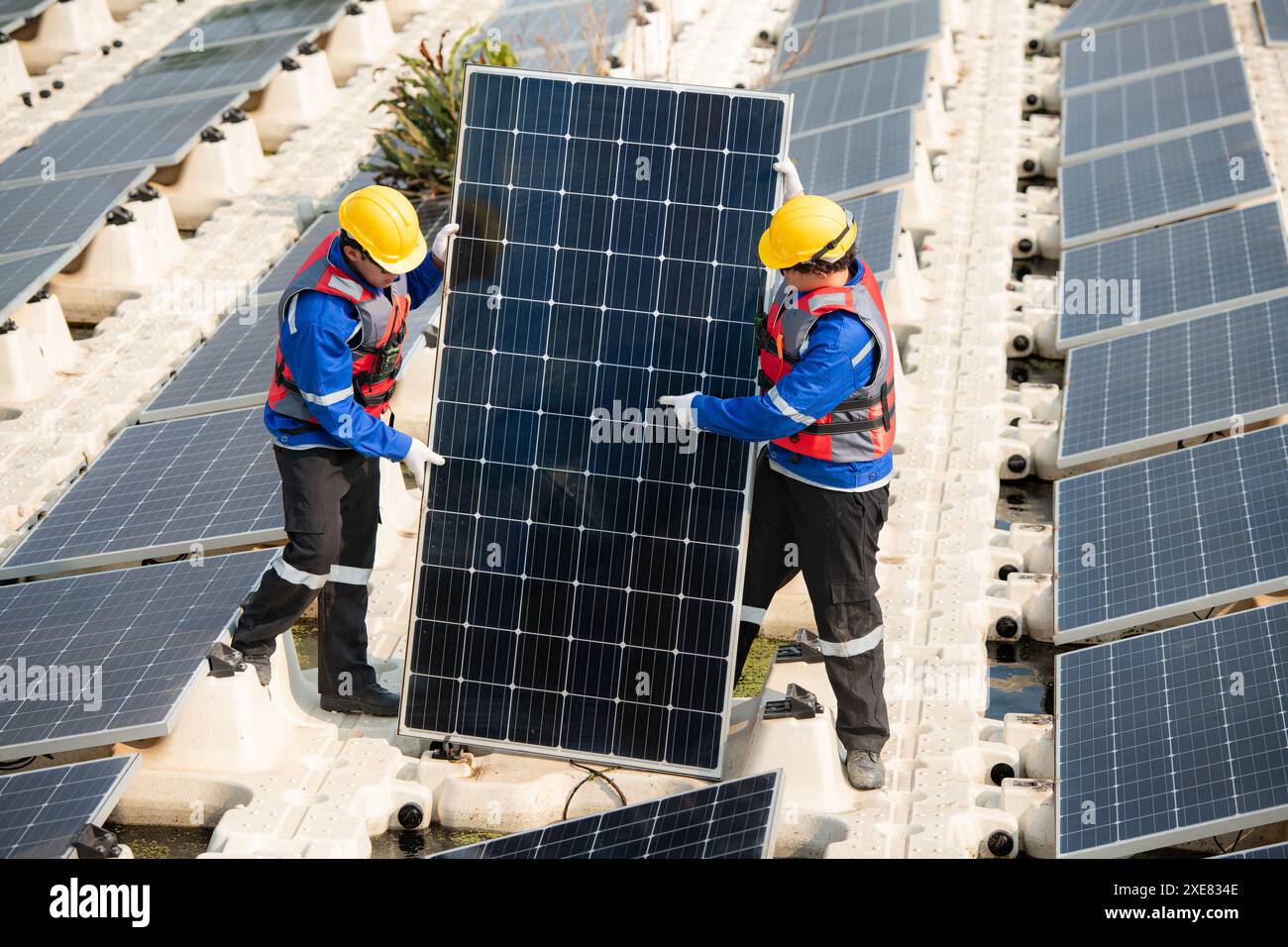 Photovoltaic engineers work on floating photovoltaics. Inspect and ...