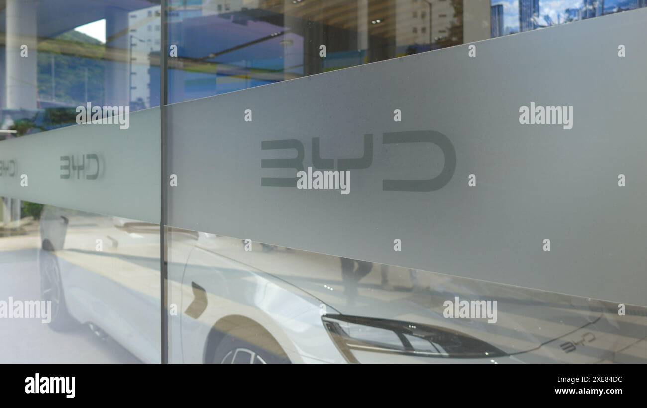 BYD's logo is displayed in the front window of the BYD store located in ...