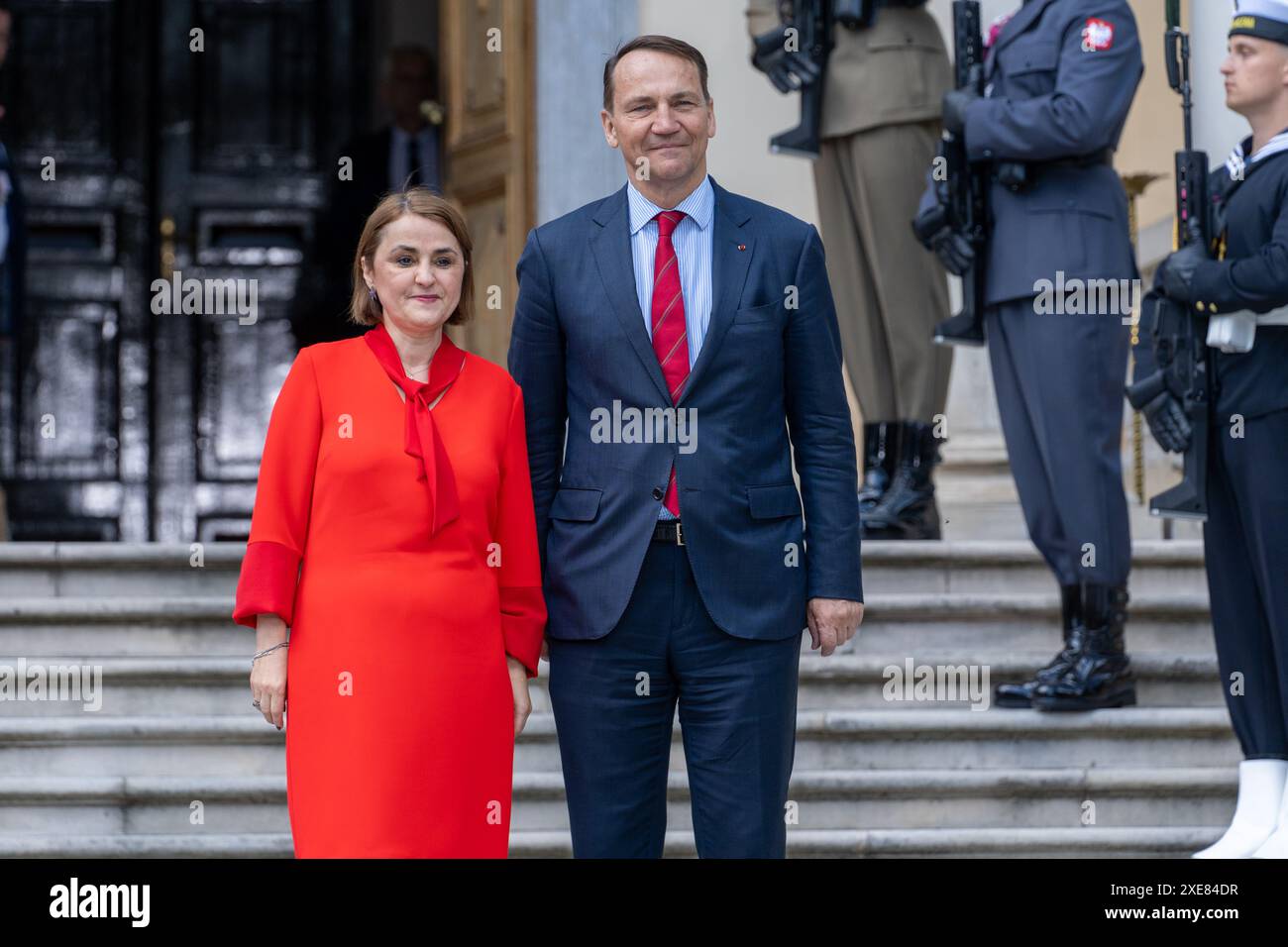 Minister of Foreign Affairs Radoslaw Sikorski greets the Minister of Foreign Affairs of Romania ...