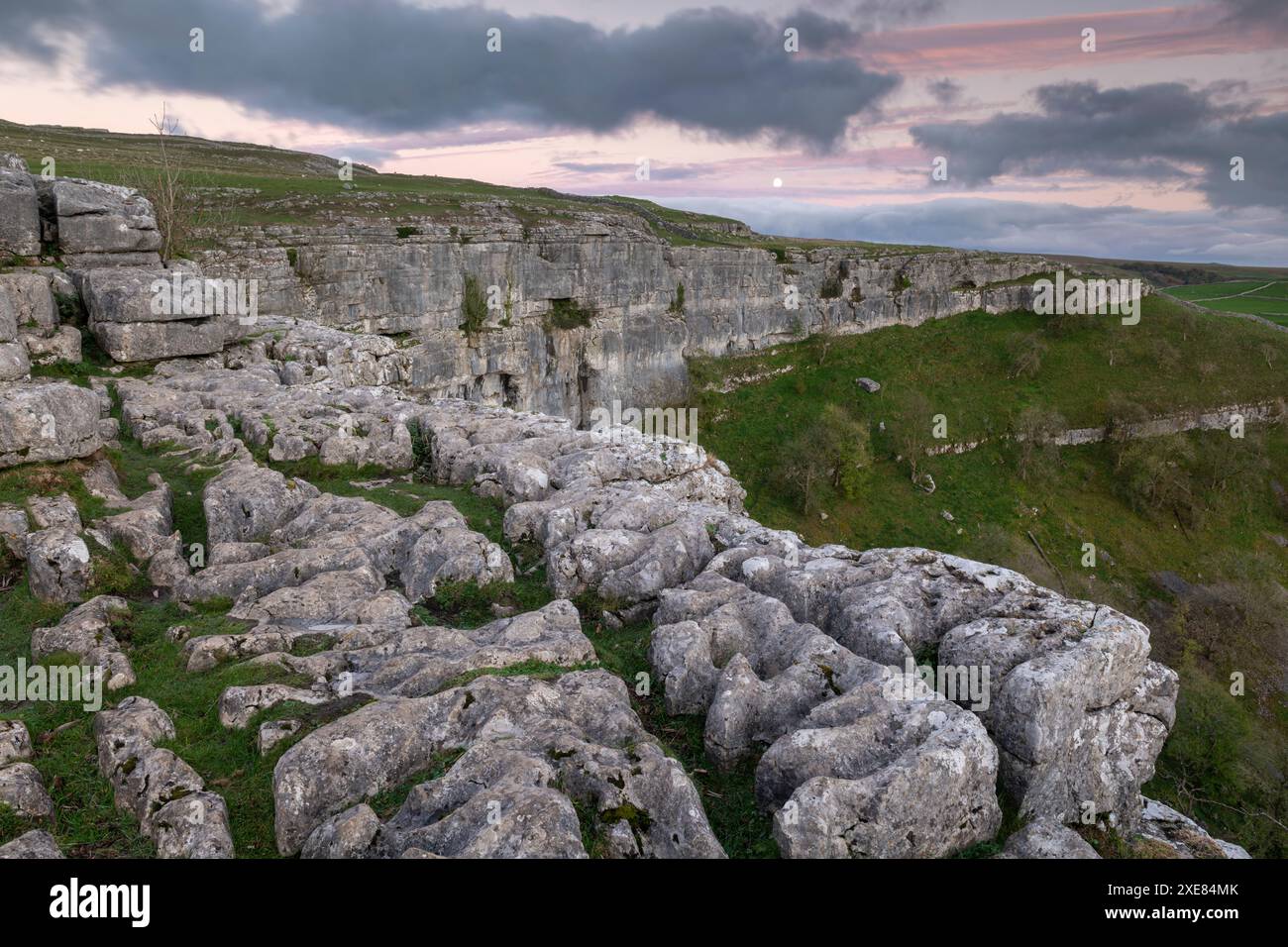 Limestone cliffs above Malham Cove in the Yorkshire Dales National Park ...