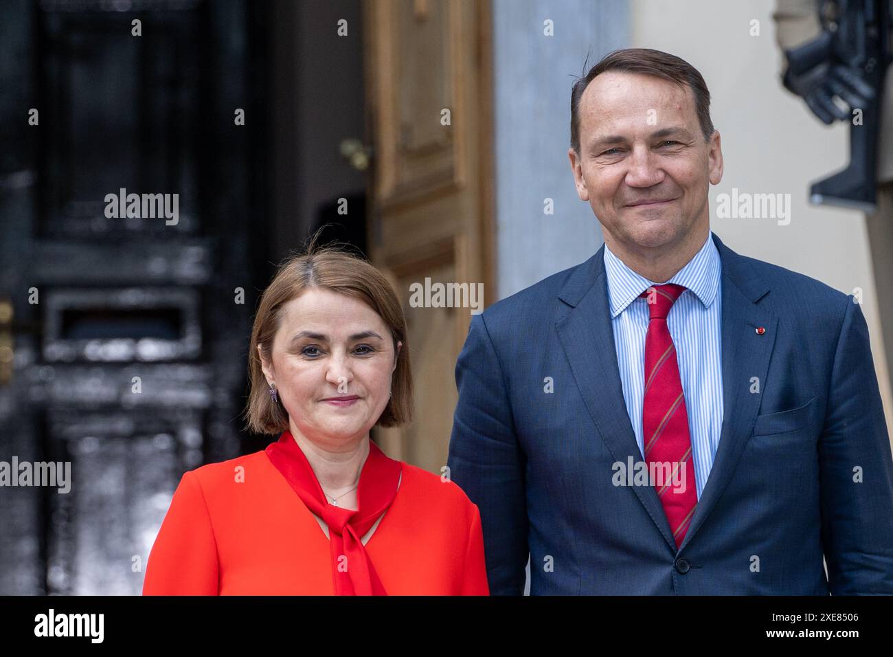 Minister of Foreign Affairs Radoslaw Sikorski greets the Minister of Foreign Affairs of Romania ...