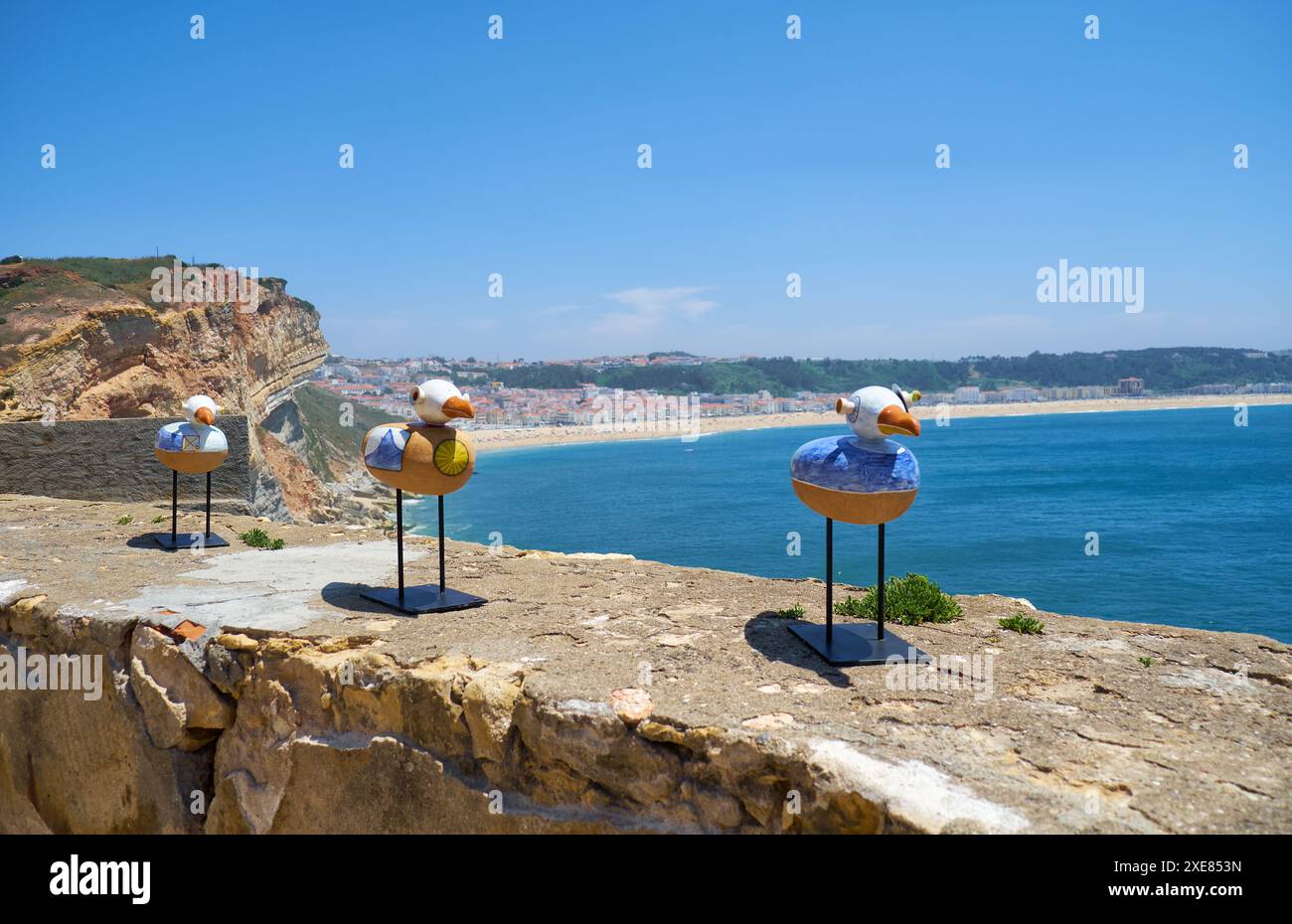 Installation art of seagulls seating on the parapet of Nazare ...