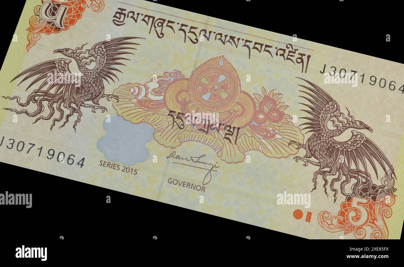 5 Ngultrum banknote printed by Bhutan, that shows Dharma Chakra with ...