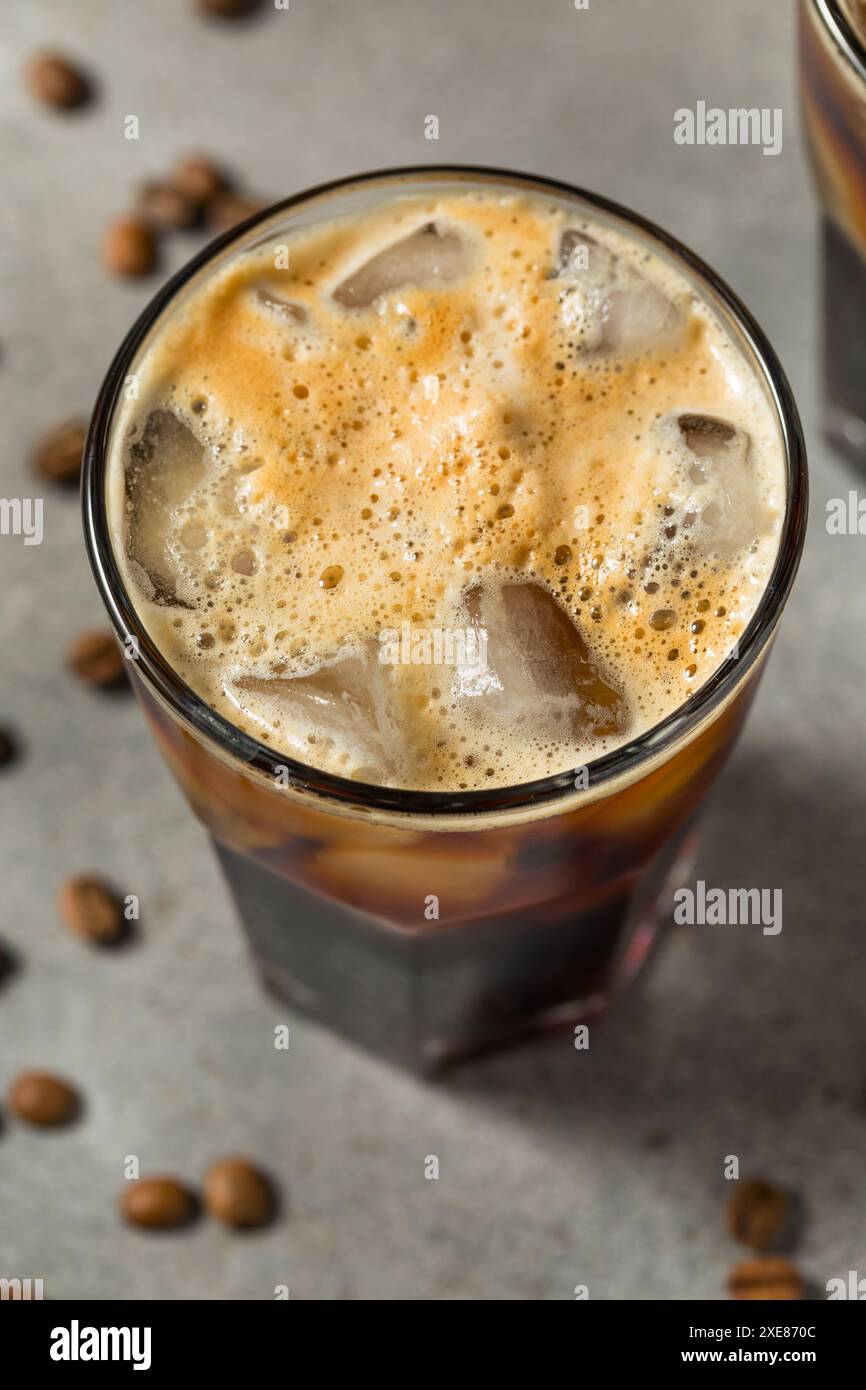 Cold Iced Americano Coffee in a Glass with Ice Stock Photo - Alamy