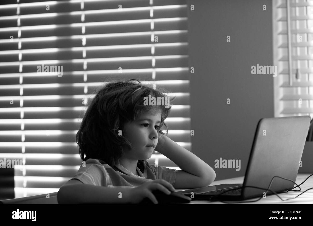 Education and learning for kids. Portrait of concentrated kid surfing ...
