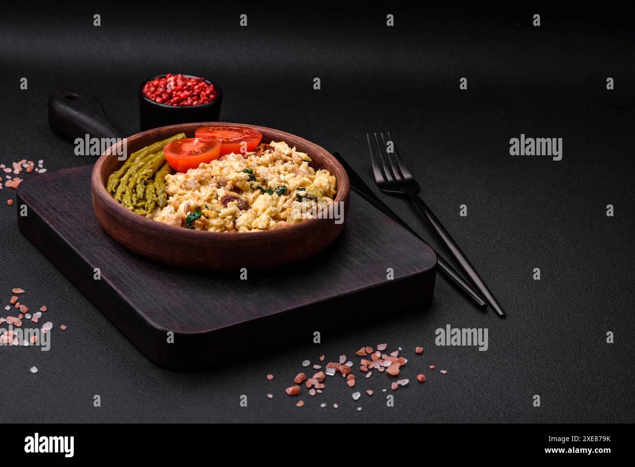 Delicious scramble with salmon, sun-dried tomatoes, spinach, spices and ...