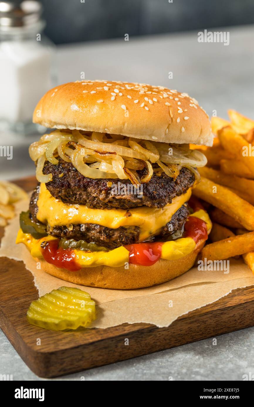 Homemade Chicago Big Baby Cheeseburger with Pickles and Onions Stock ...