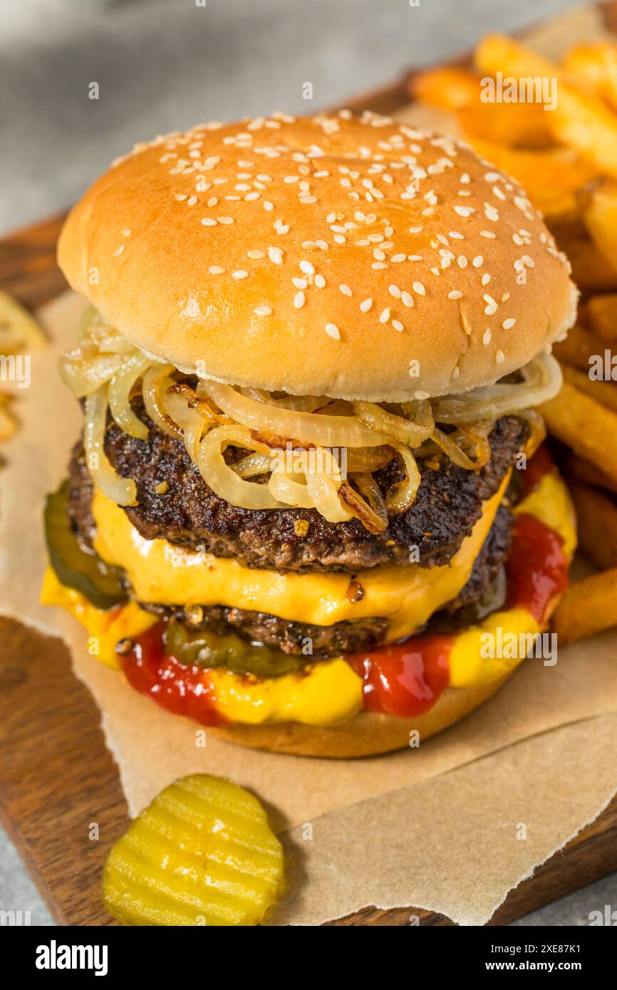 Homemade Chicago Big Baby Cheeseburger with Pickles and Onions Stock ...