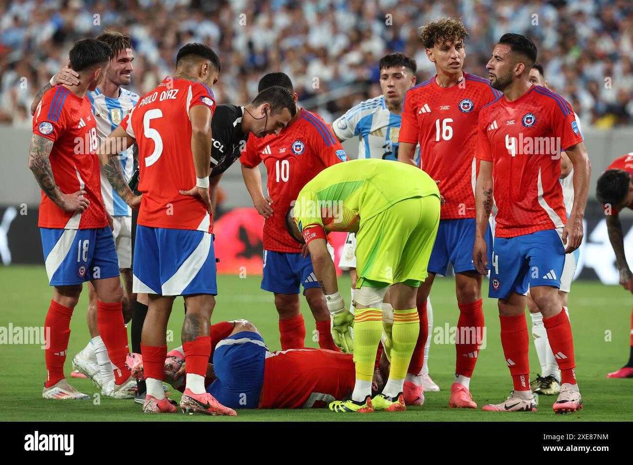 Uruguayan referee Andres Matonte (C) looks a Chile’s player during the ...