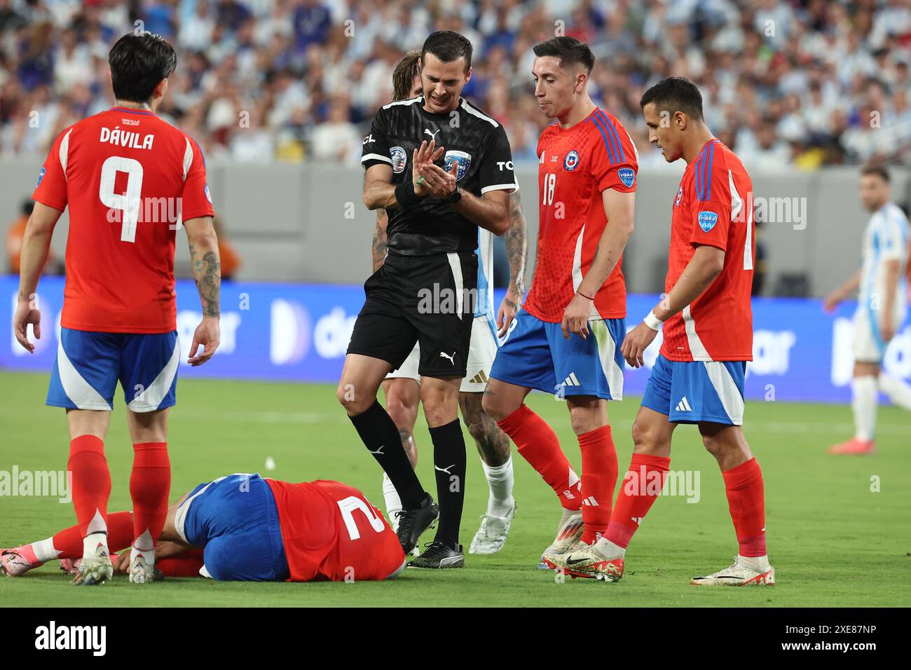 Uruguayan referee Andres Matonte (C) chats with Chile’s players during ...