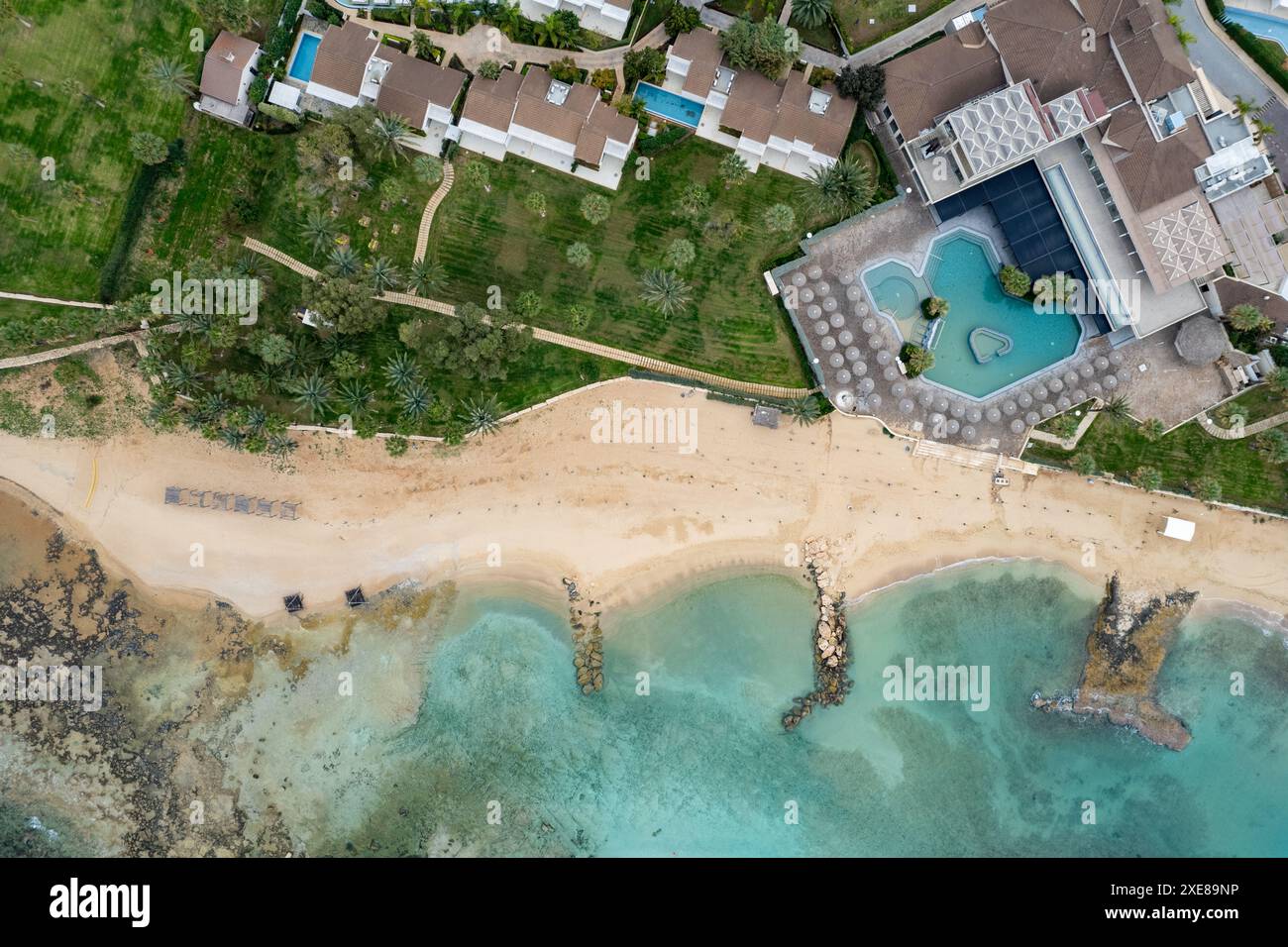 Drone aerial of luxury holiday hotel resort and sandy tropical beach in ...