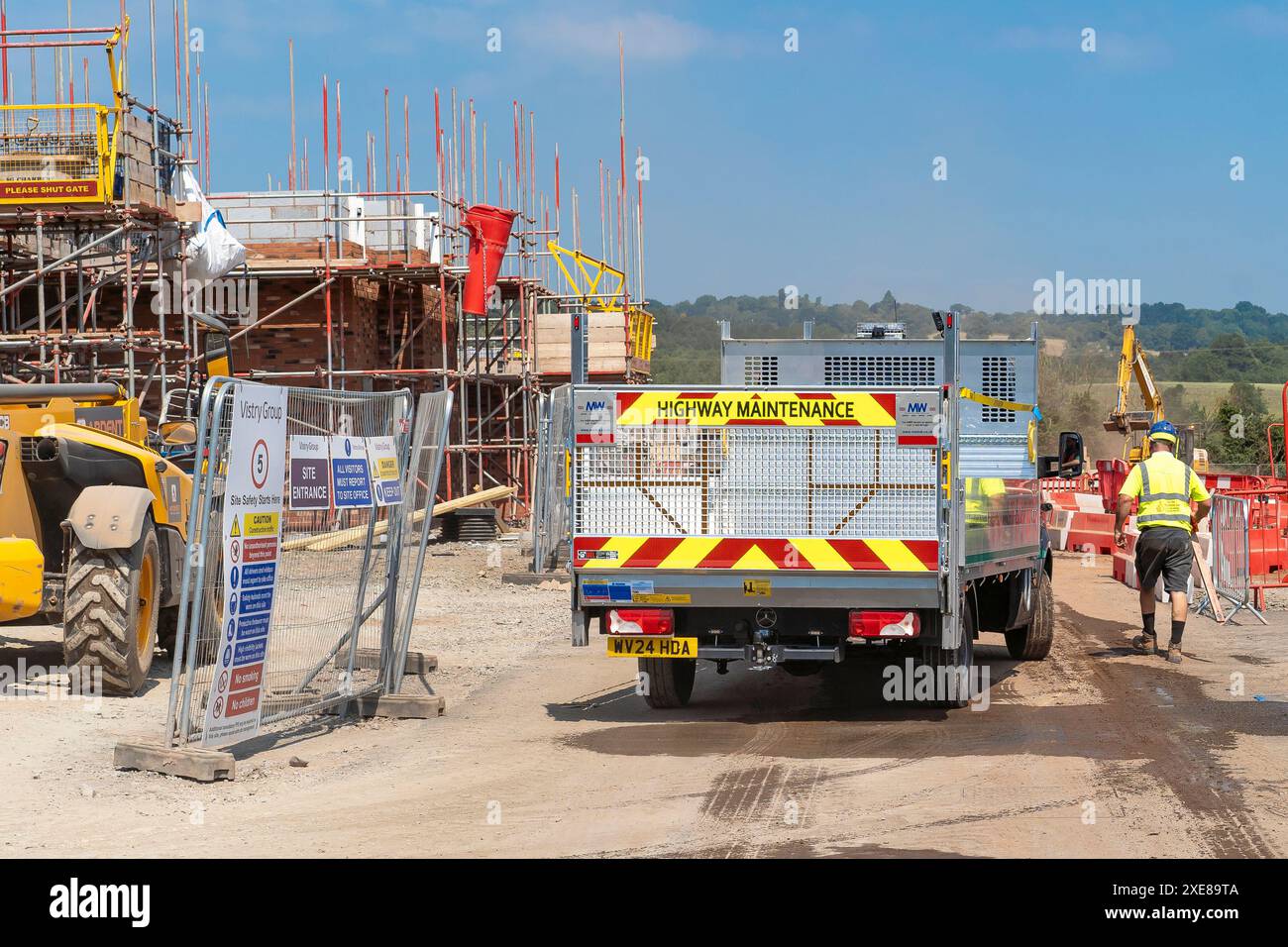 Construction site vehicles on a new build building site Stock Photo - Alamy