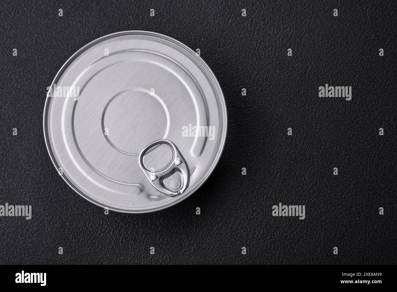 Tin metal can with canned food round shape with a key Stock Photo - Alamy
