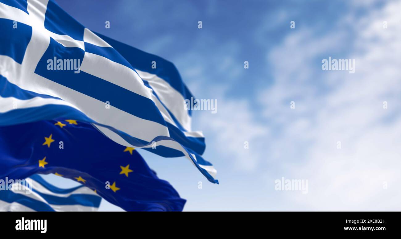 National flags of Greece waving in the wind with flag of the European ...