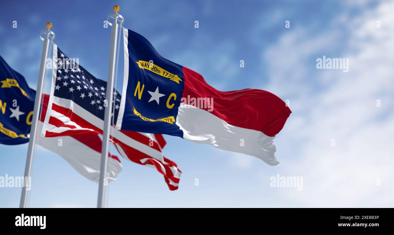 North Carolina state flags waving with american flag. North Carolina is ...