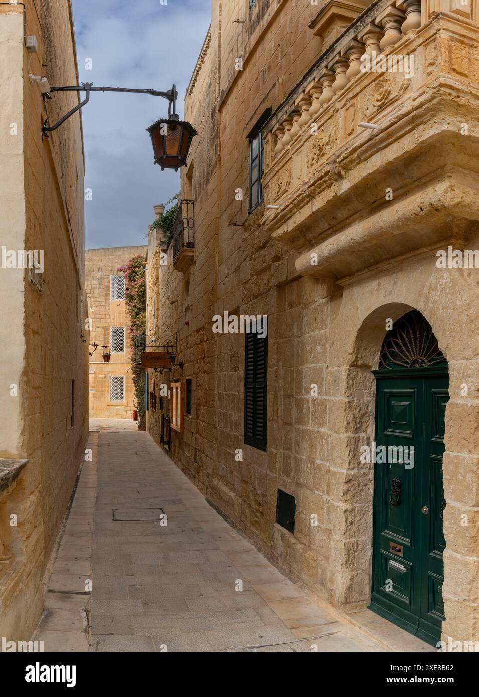 Typical yellow-ochre limestone buildings in the old town of Mdina in ...