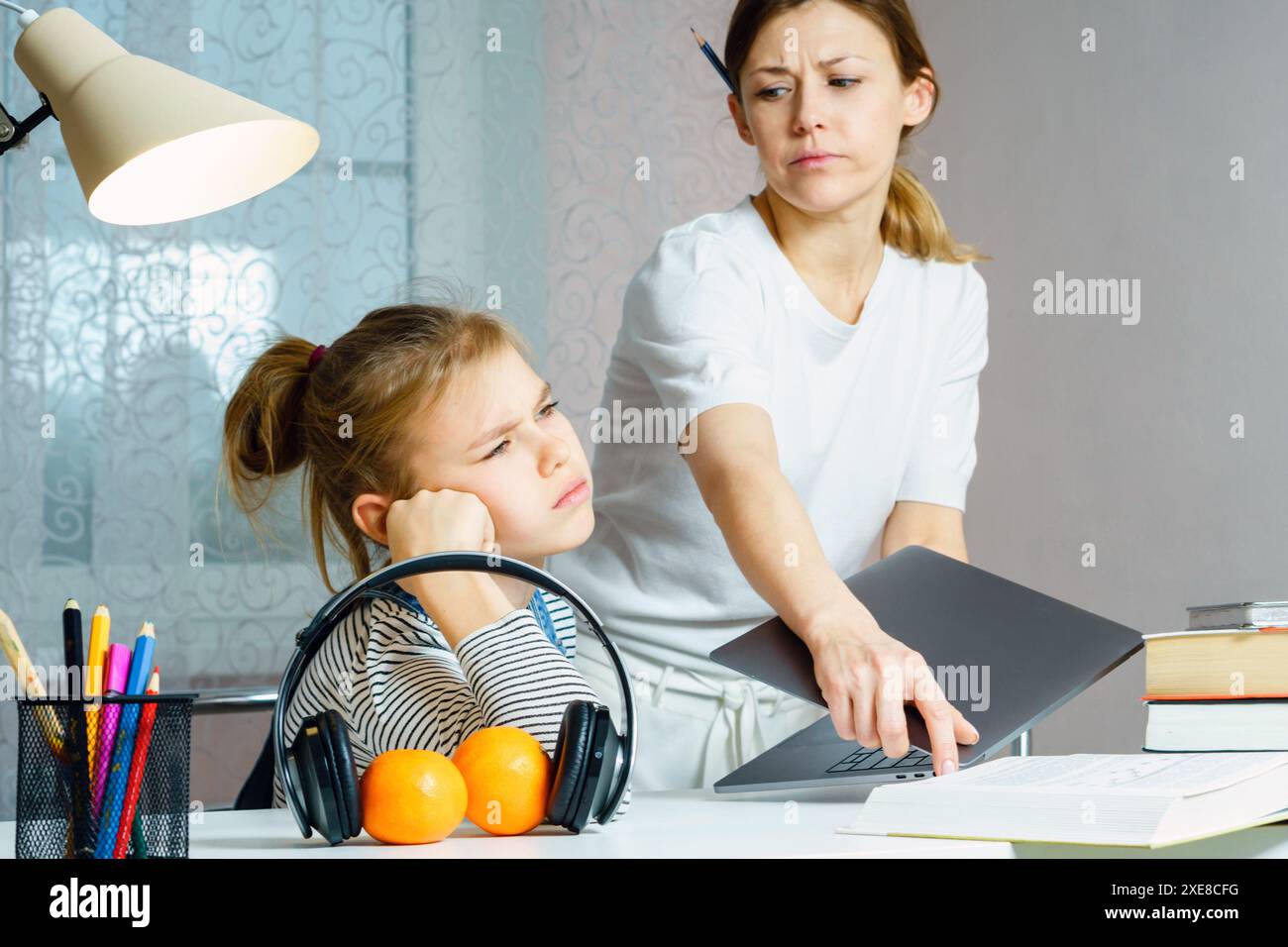 Mother Arguing With Teenage Daughter Over Online Activity taking away ...