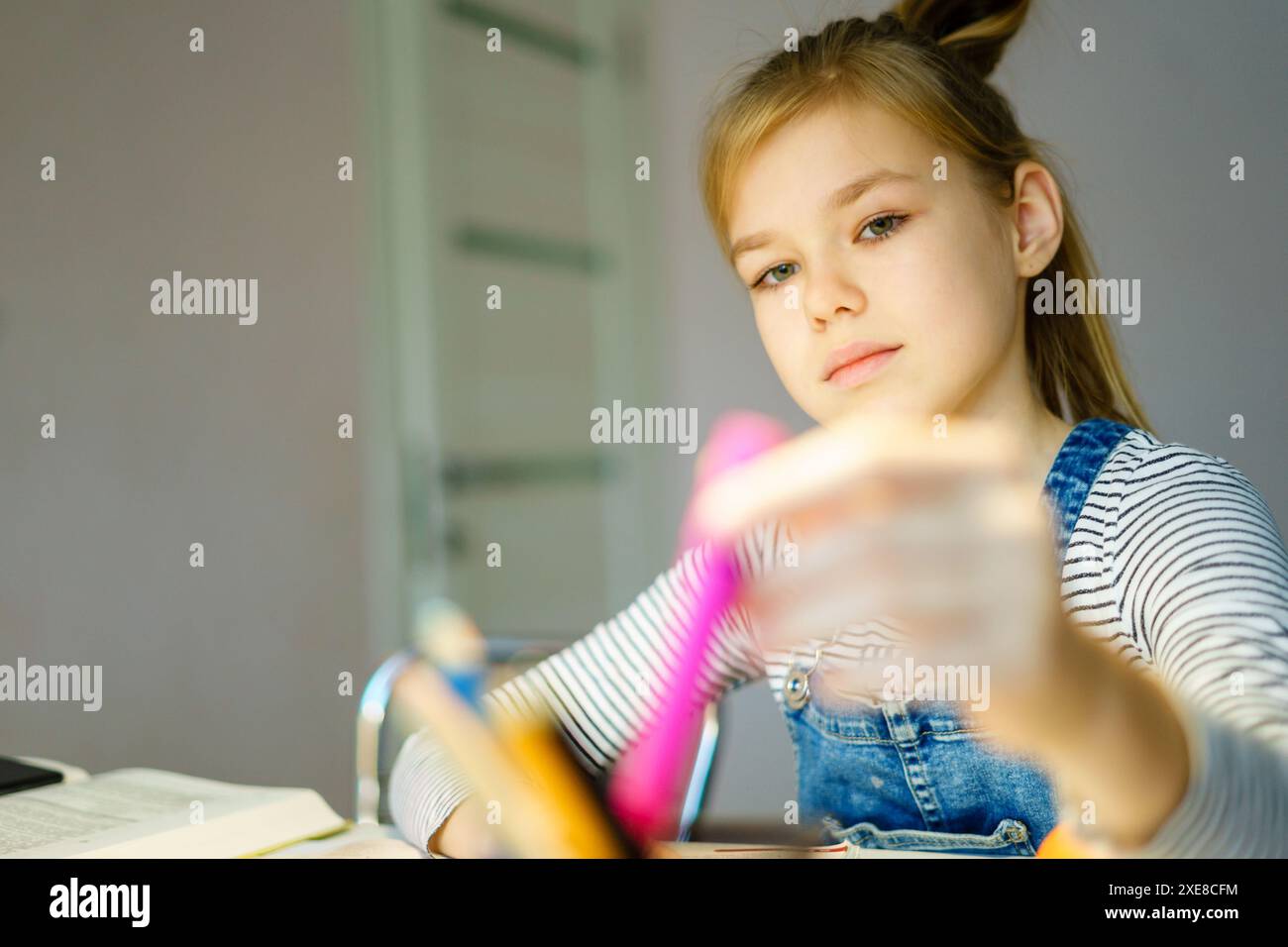 Beautiful girl working on her school project at home, education concept ...