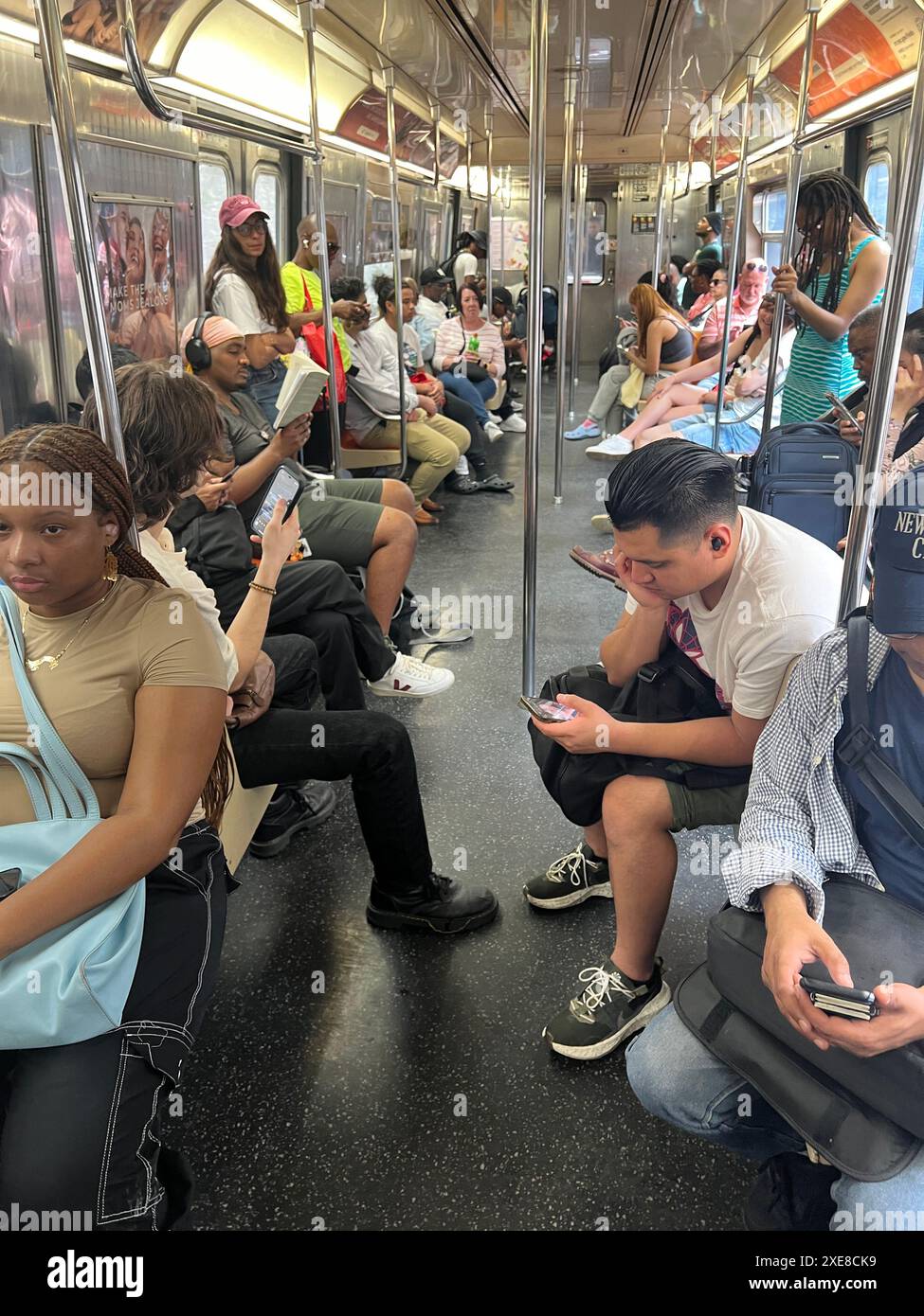 Weekend riders on a subway train in Brooklyn, New York Stock Photo - Alamy