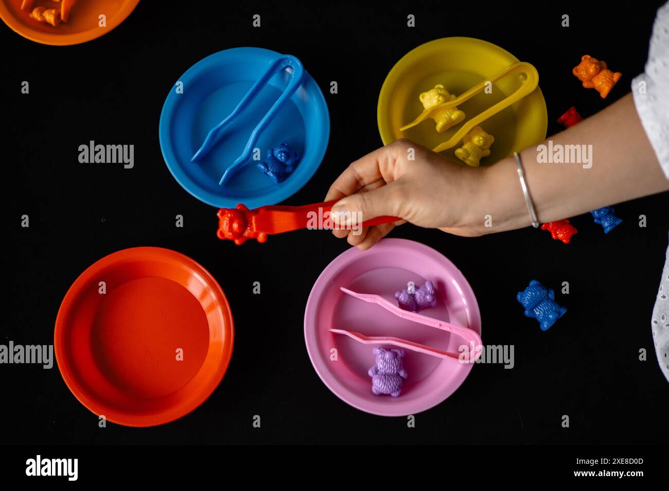development of fine motor skills for children using tweezers and small ...