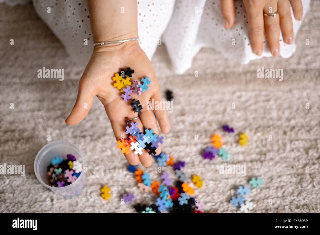 Womans hand holding puzzle hi-res stock photography and images - Alamy