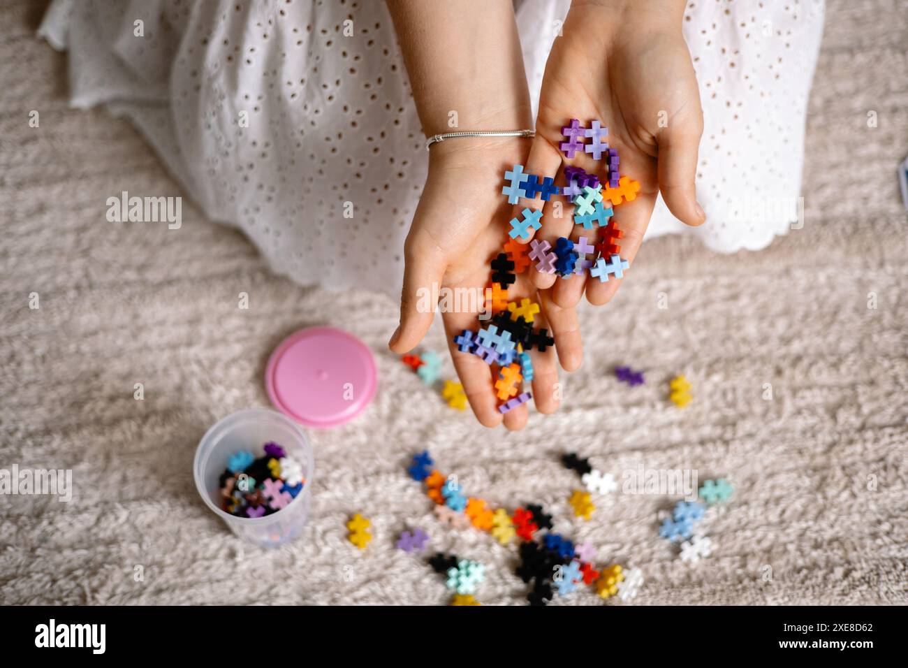 Womans hand holding puzzle hi-res stock photography and images - Alamy