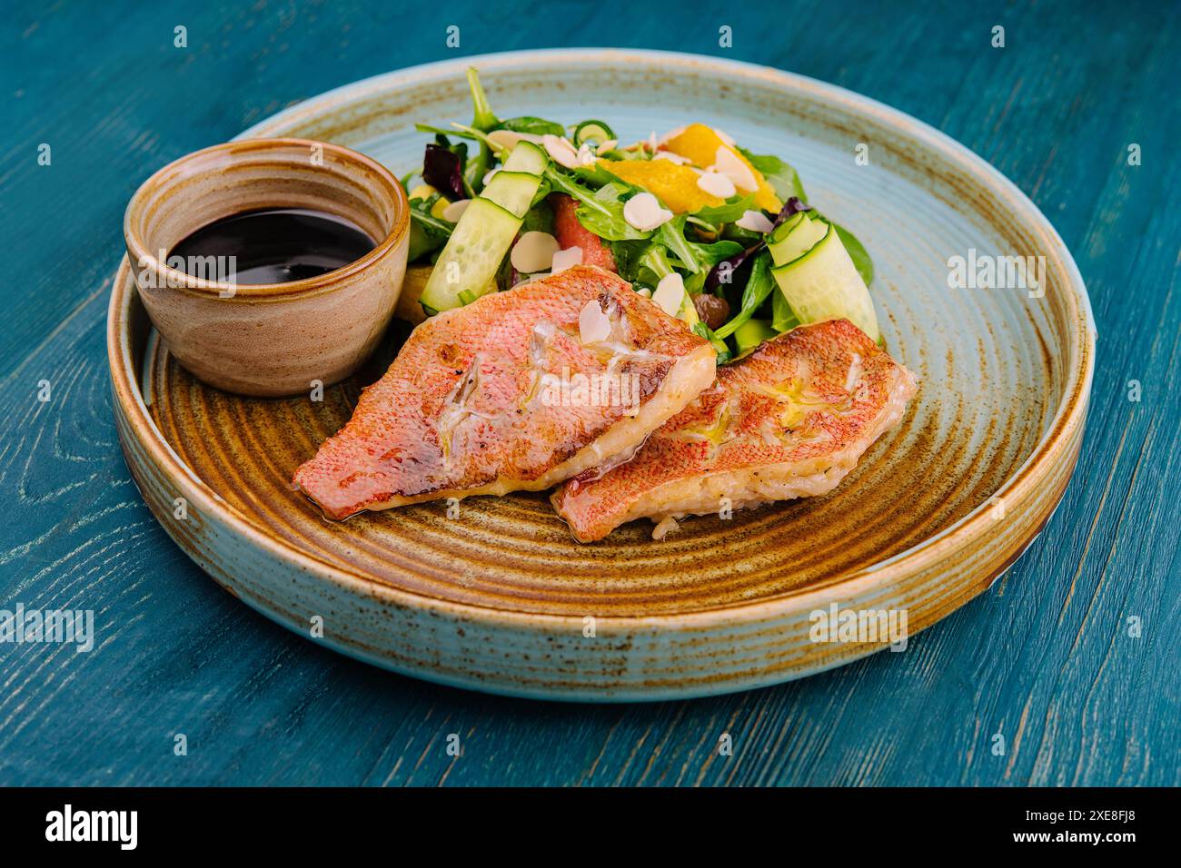 Grilled Red Snapper fish fillets and fresh vegetable salad Stock Photo ...