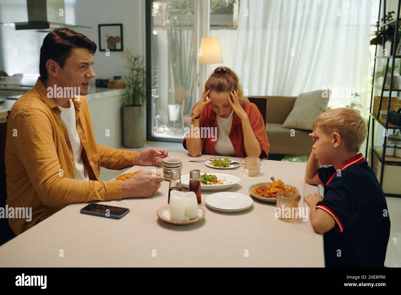 Parents arguing with each other in the presence of his child during ...
