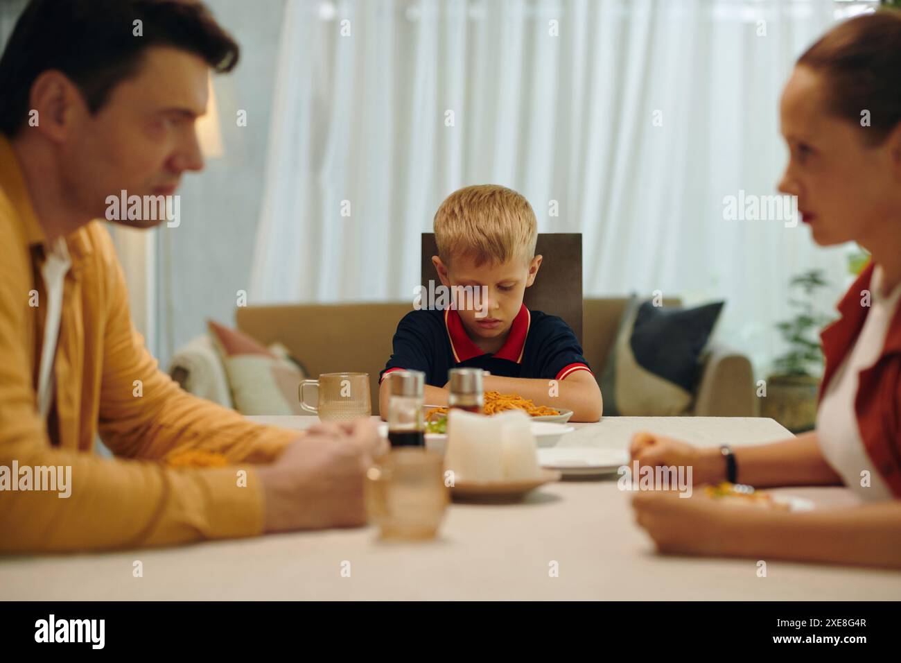 Parents argument child dining table hi-res stock photography and images ...