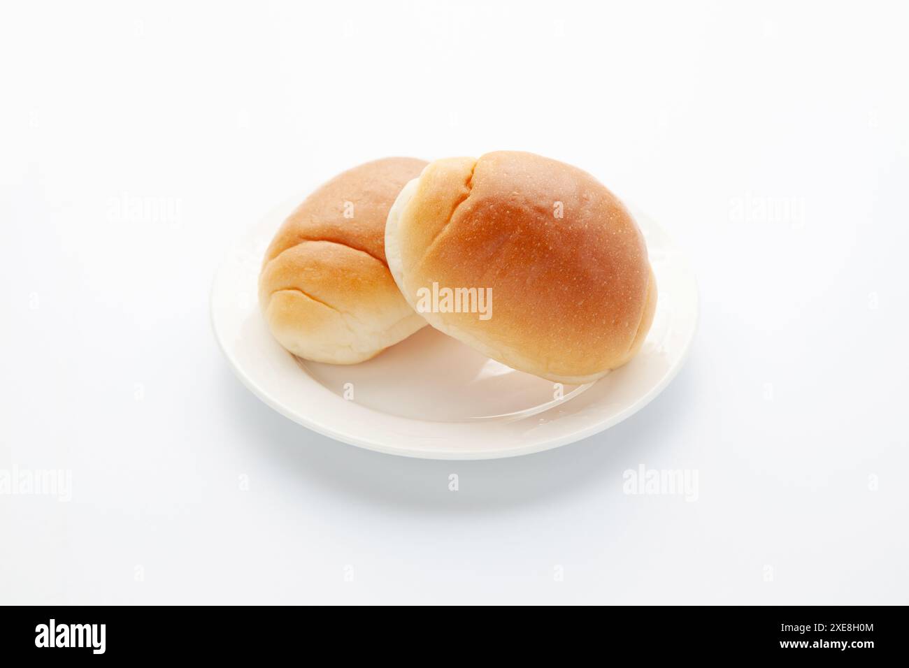 butter bread table rolls on plate isolated on white background Stock ...
