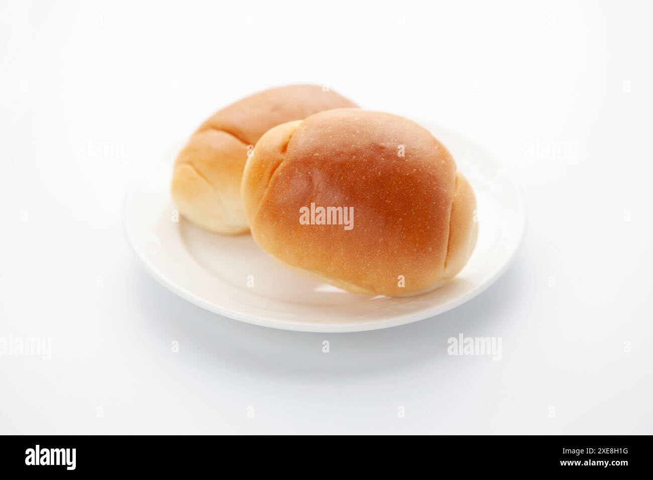 butter bread table rolls on plate isolated on white background Stock ...