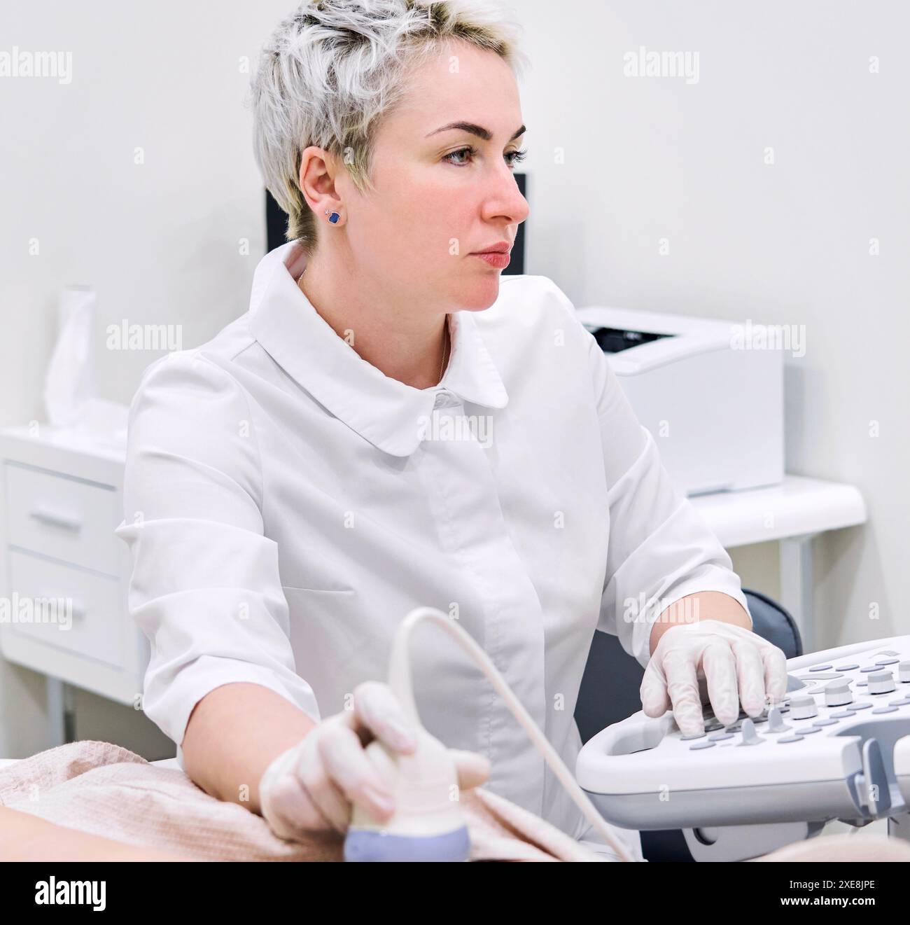 Gynecologist doing ultrasound scan in modern clinic Stock Photo - Alamy
