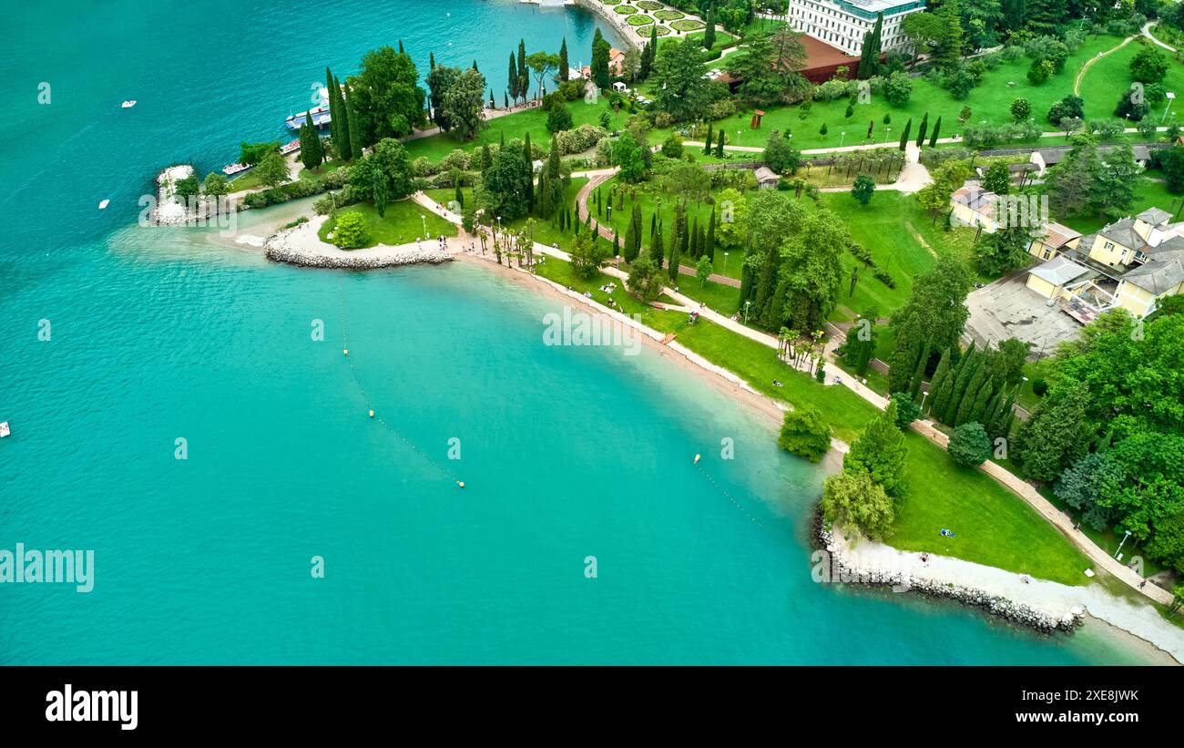 Riva del Garda, Lake Garda, Italy - June 25, 2024: Beautiful beach with ...