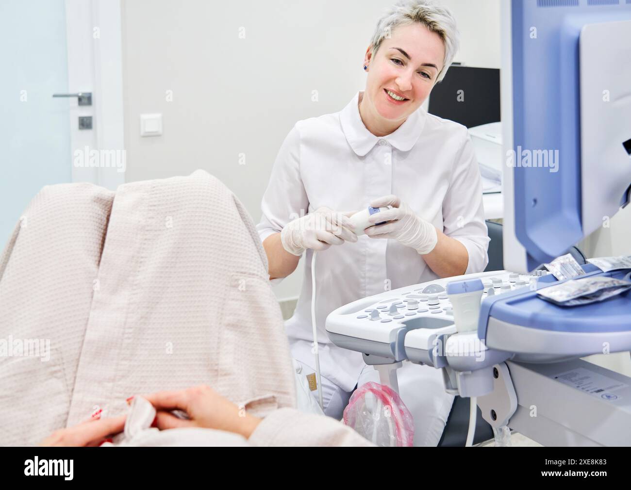 Gynecologist doing ultrasound scan in modern clinic Stock Photo - Alamy