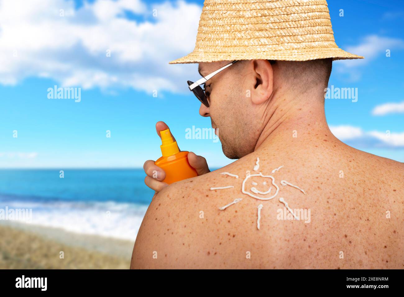 Middle aged caucasian male model applying sunscreen Stock Photo - Alamy