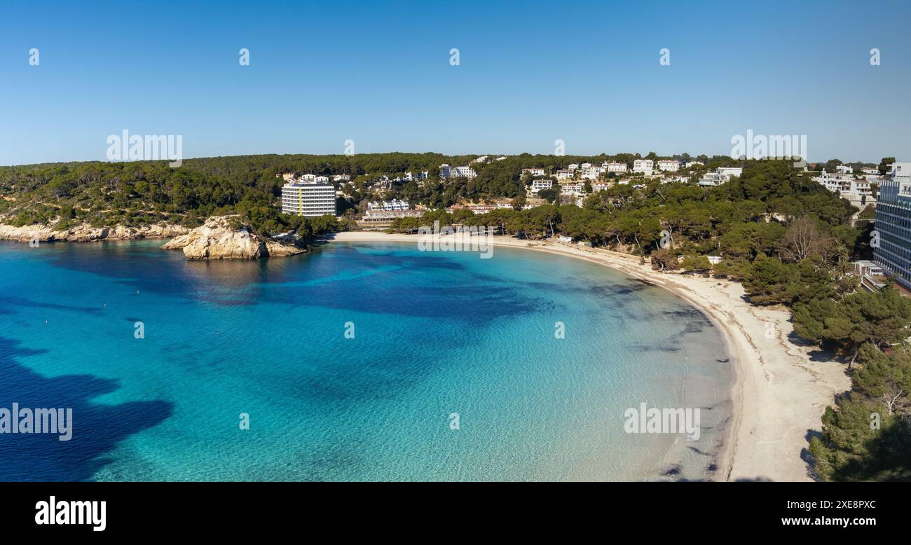 View of the beautiful sandy beach and seaside resort of Cala Galdana on ...