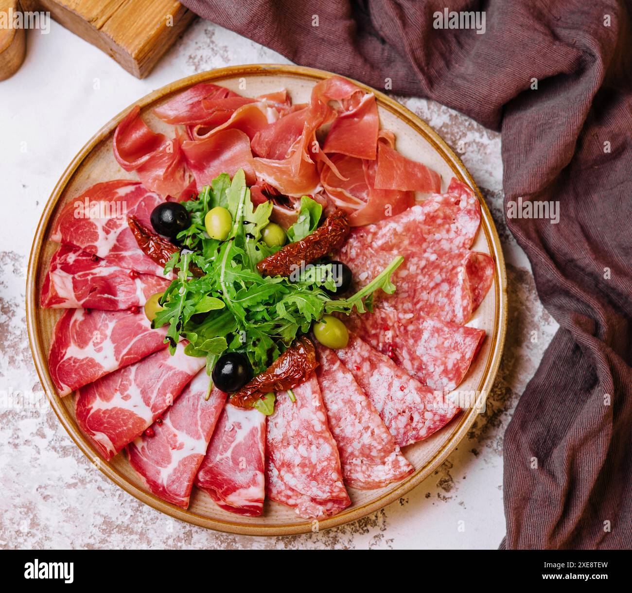 Traditional spanish jamon, prosciutto crudo, italian salami Stock Photo ...