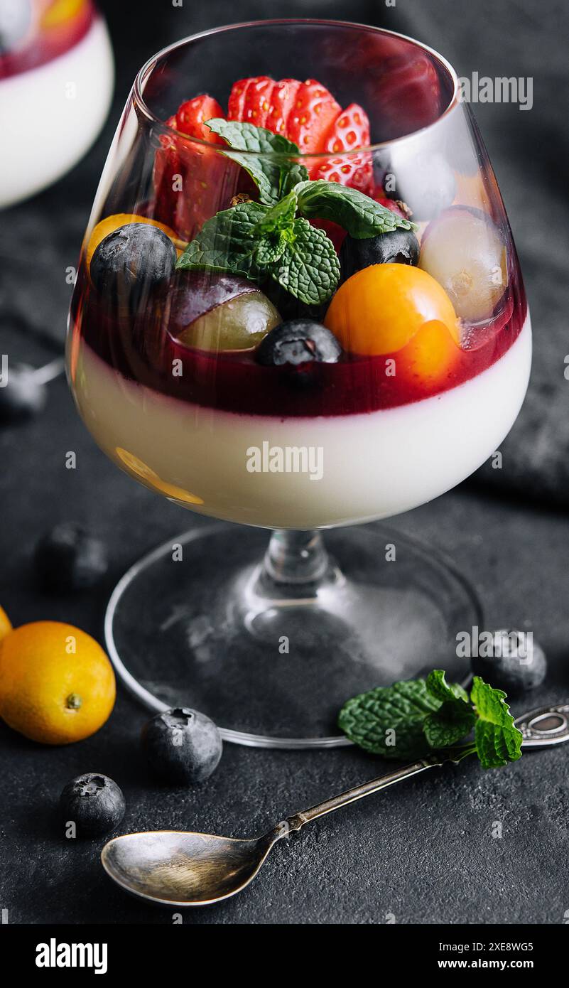 Dessert, creamy panna cotta with cherry sauce with fresh berries Stock ...