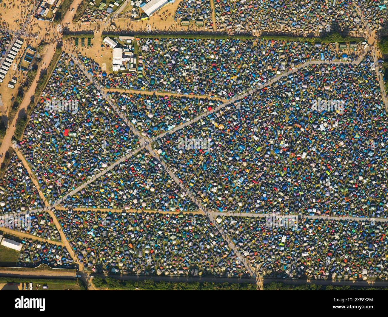 Aerial Image Glastonbury Festival, showing colourful mosaic of tents ...