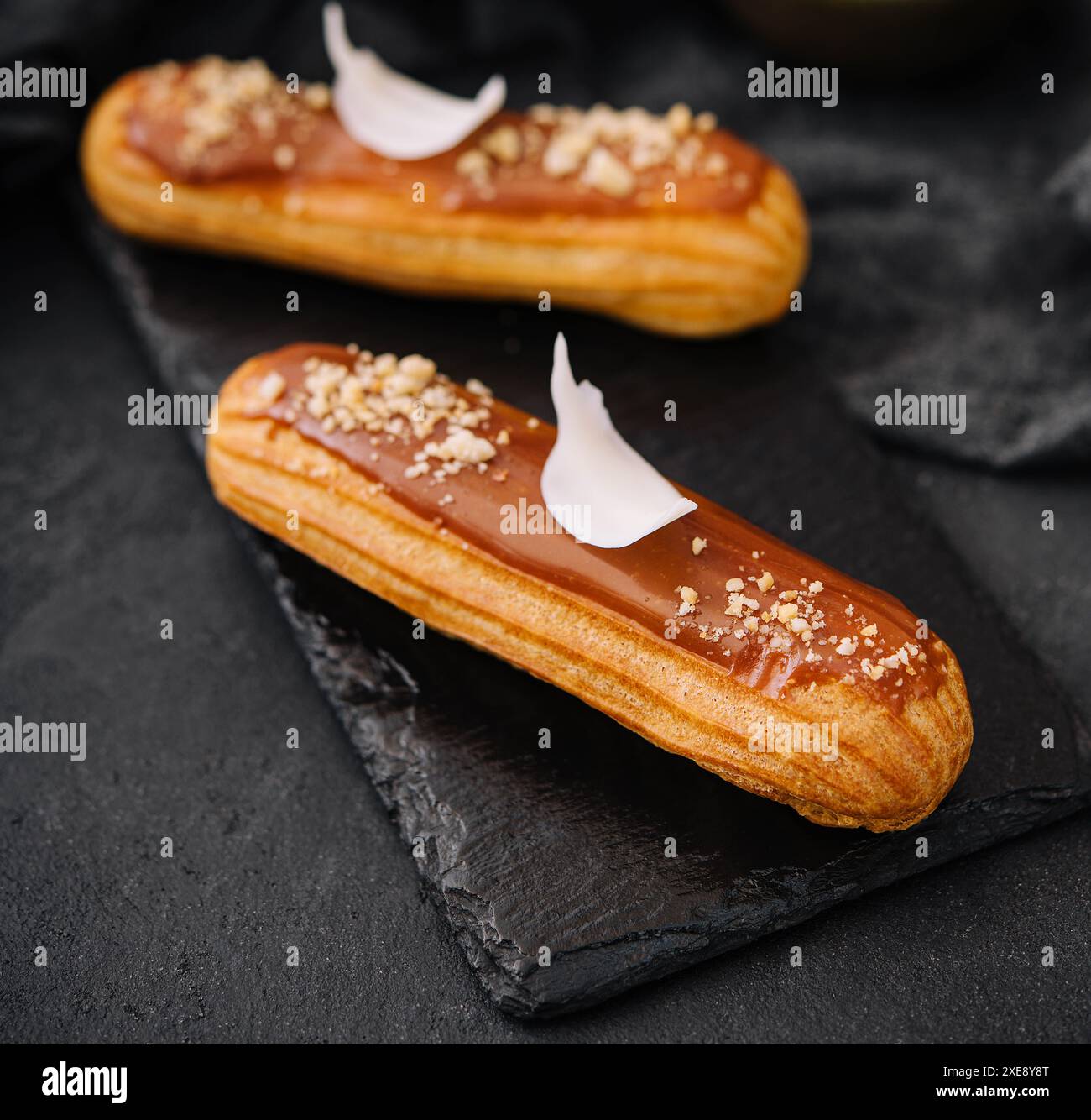 Traditional french dessert. eclair with caramel Stock Photo - Alamy