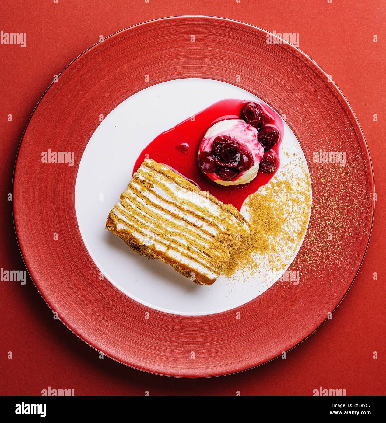Napoleon cake with vanilla ice cream with cherry jam Stock Photo - Alamy