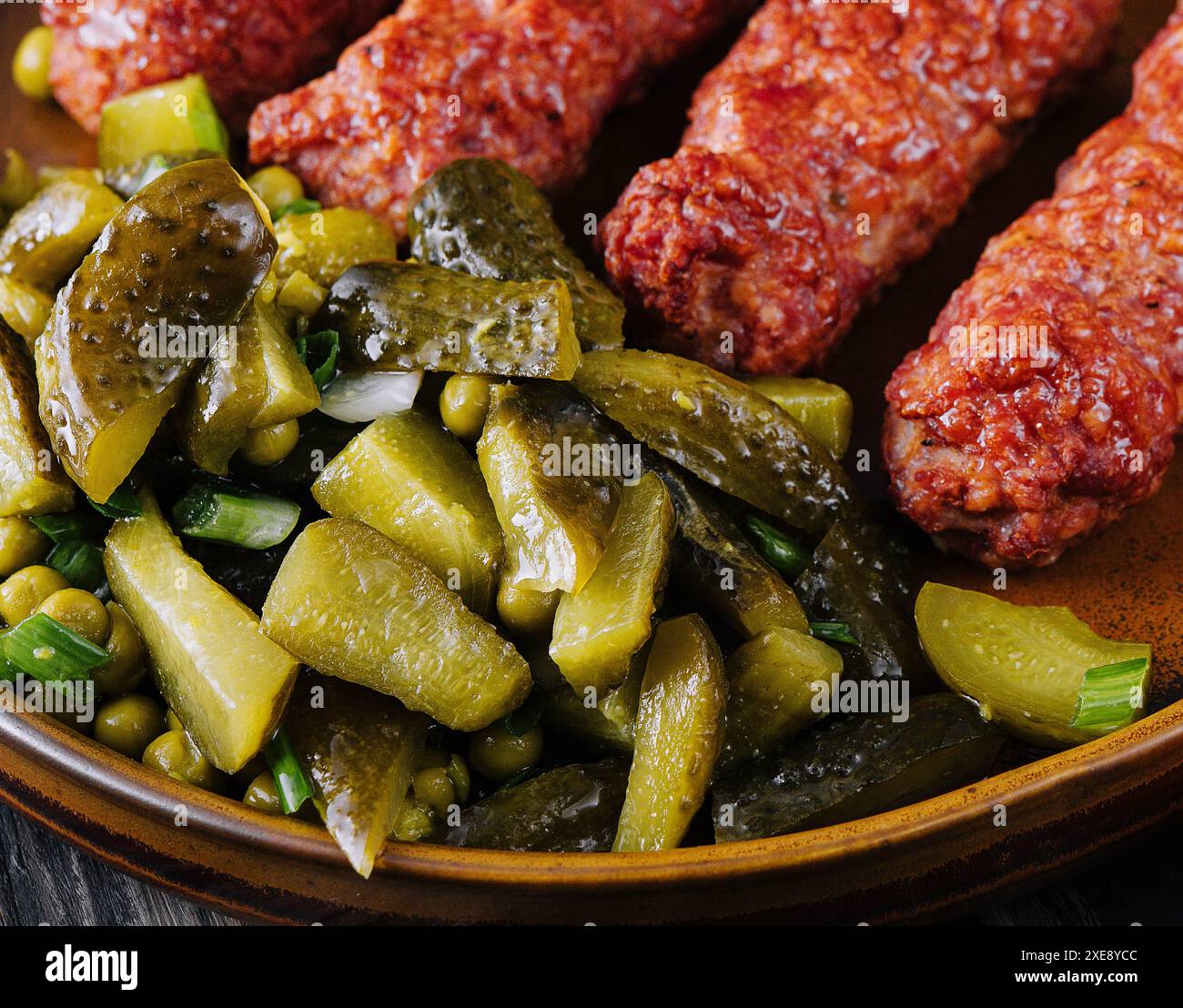 Pickled cucumbers with meat rolls mititei traditional romanian food ...