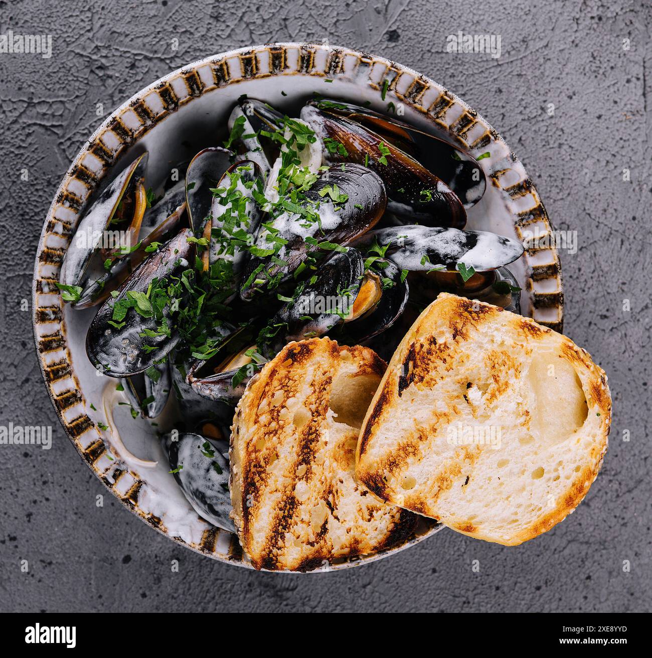 Traditional barbecue italian blue mussel with baguette Stock Photo - Alamy