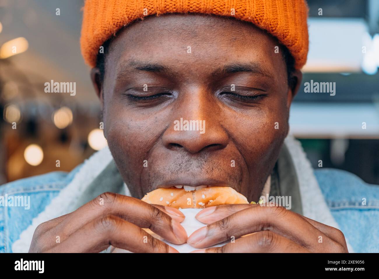 African guy enjoying lunch hi-res stock photography and images - Alamy