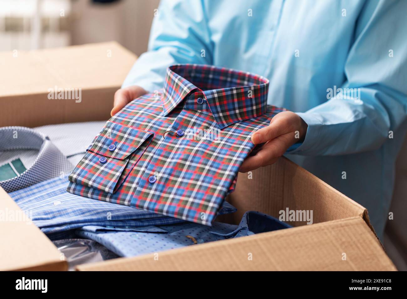 Putting on new shirts hi-res stock photography and images - Alamy
