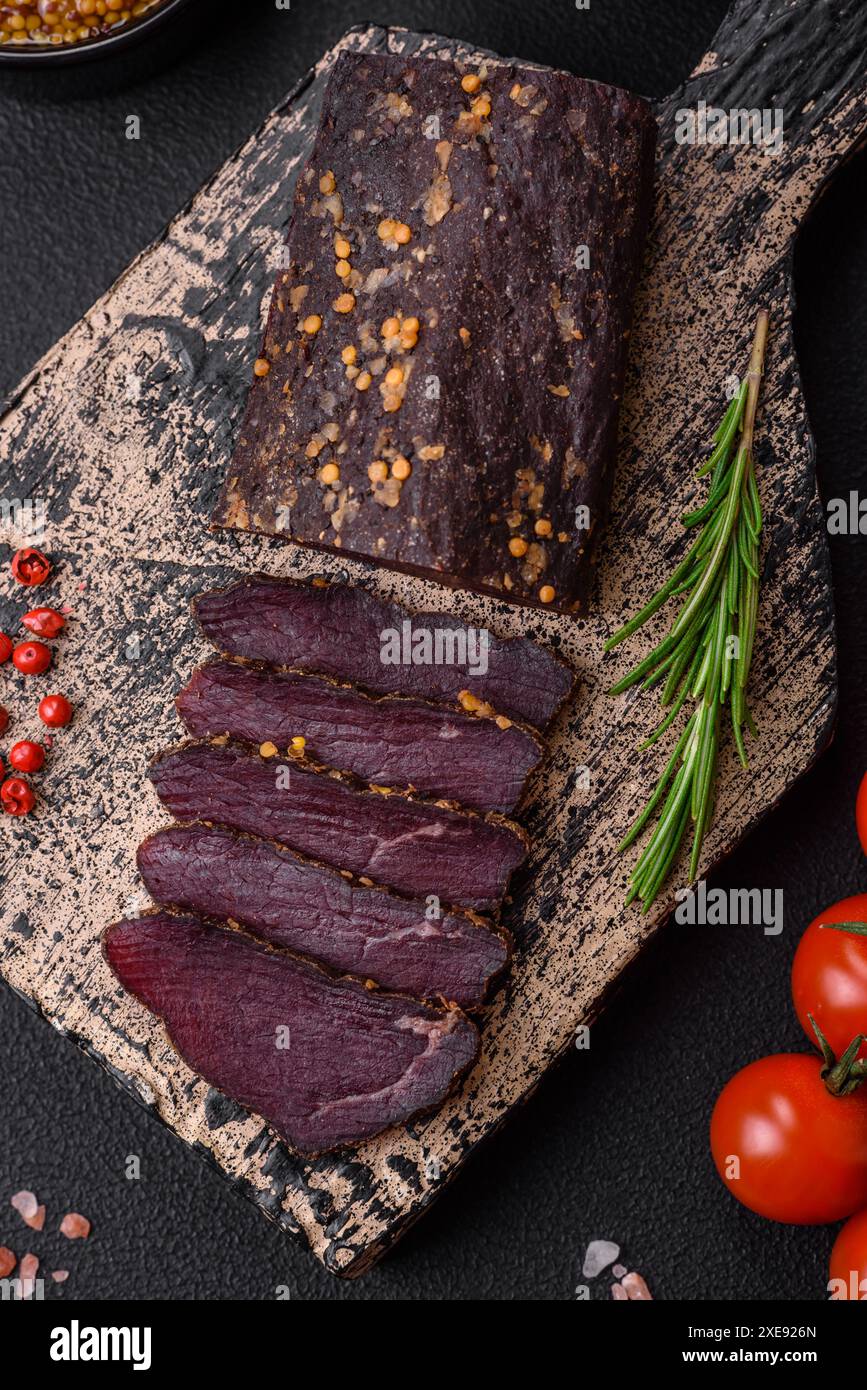 Delicious smoked Armenian basturma with spices and herbs Stock Photo ...