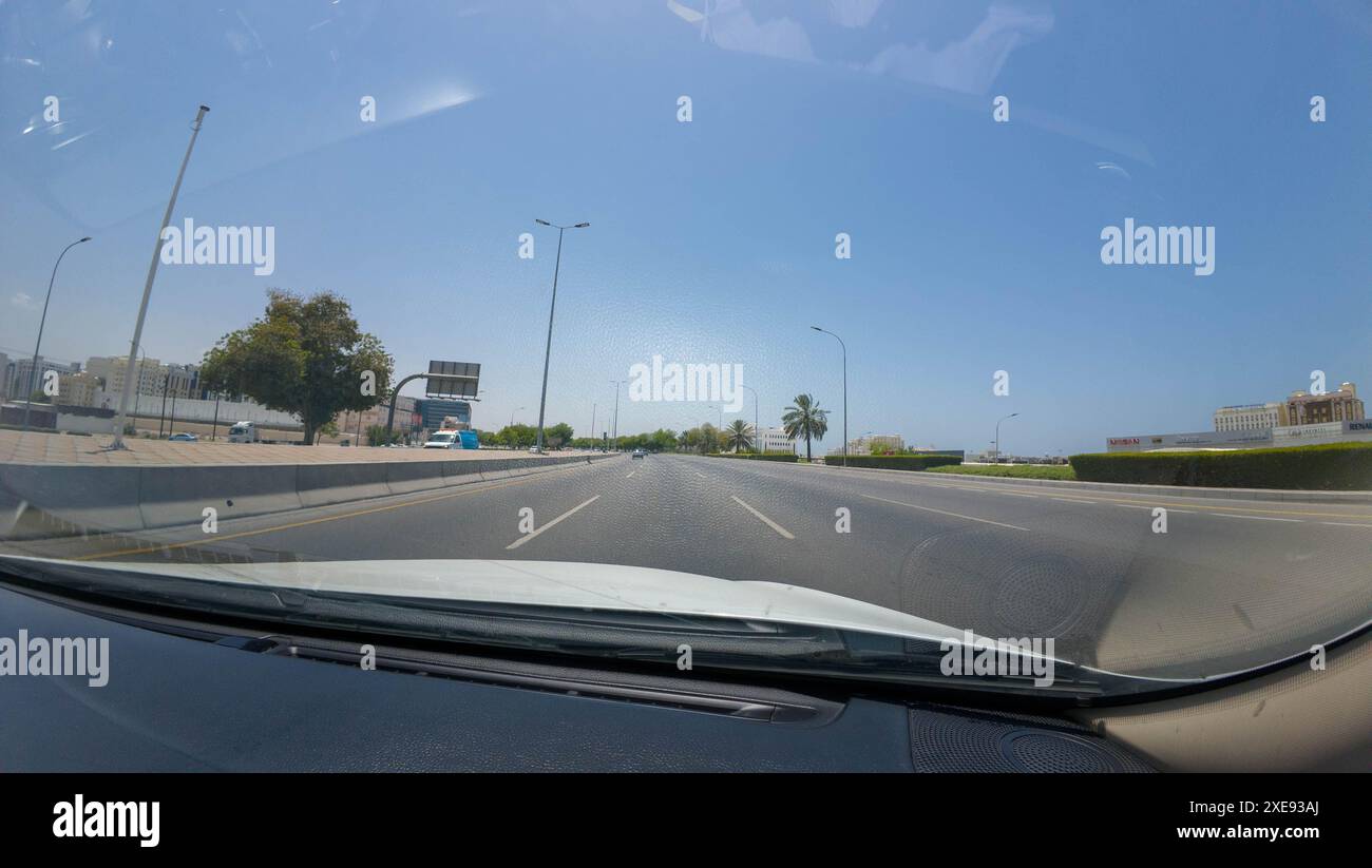Photography of a highway in a city Muscat, Oman from car during sunny ...