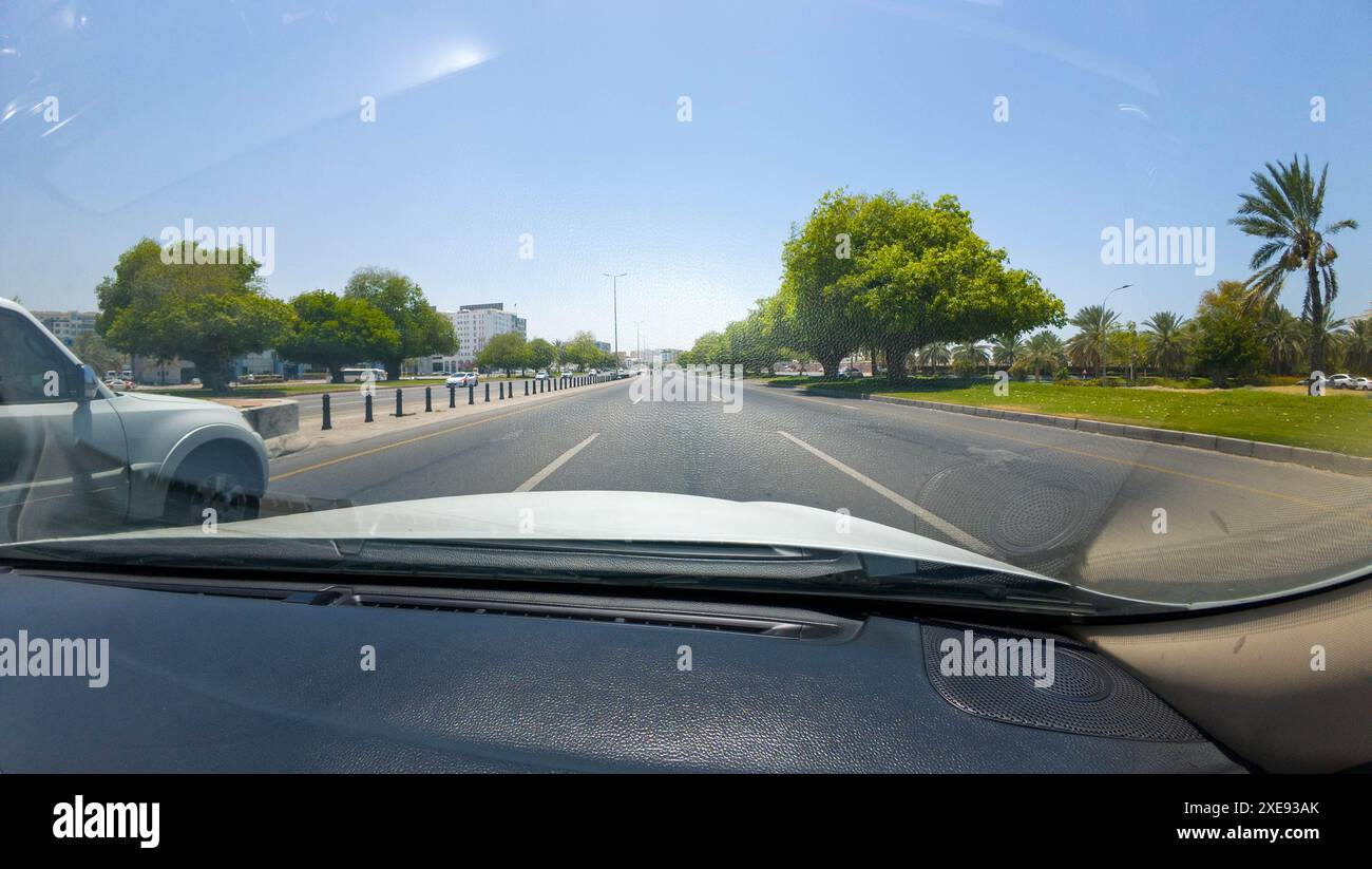 Photography of a highway in a city Muscat, Oman from car during sunny ...