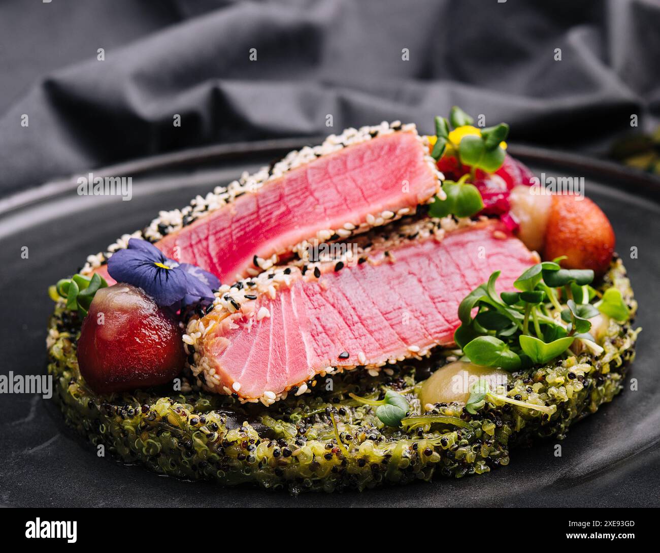 Rare ahi tuna steak slices with fresh herbs Stock Photo - Alamy